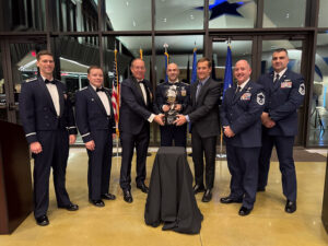 Lt. Gen. Dave Deptula and Liden Blue, CEO of General Atomics, present ...